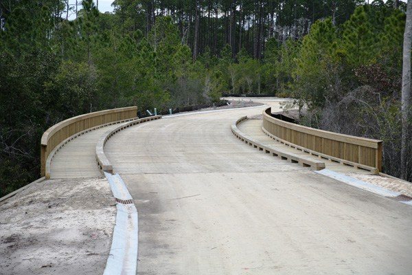 Timber Frame Bridges Add Beauty and Value - Katahdin Cedar Log Homes